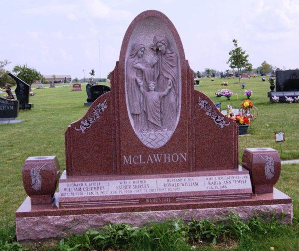 Red granite monument with bas relief of holy family – City Monument ...