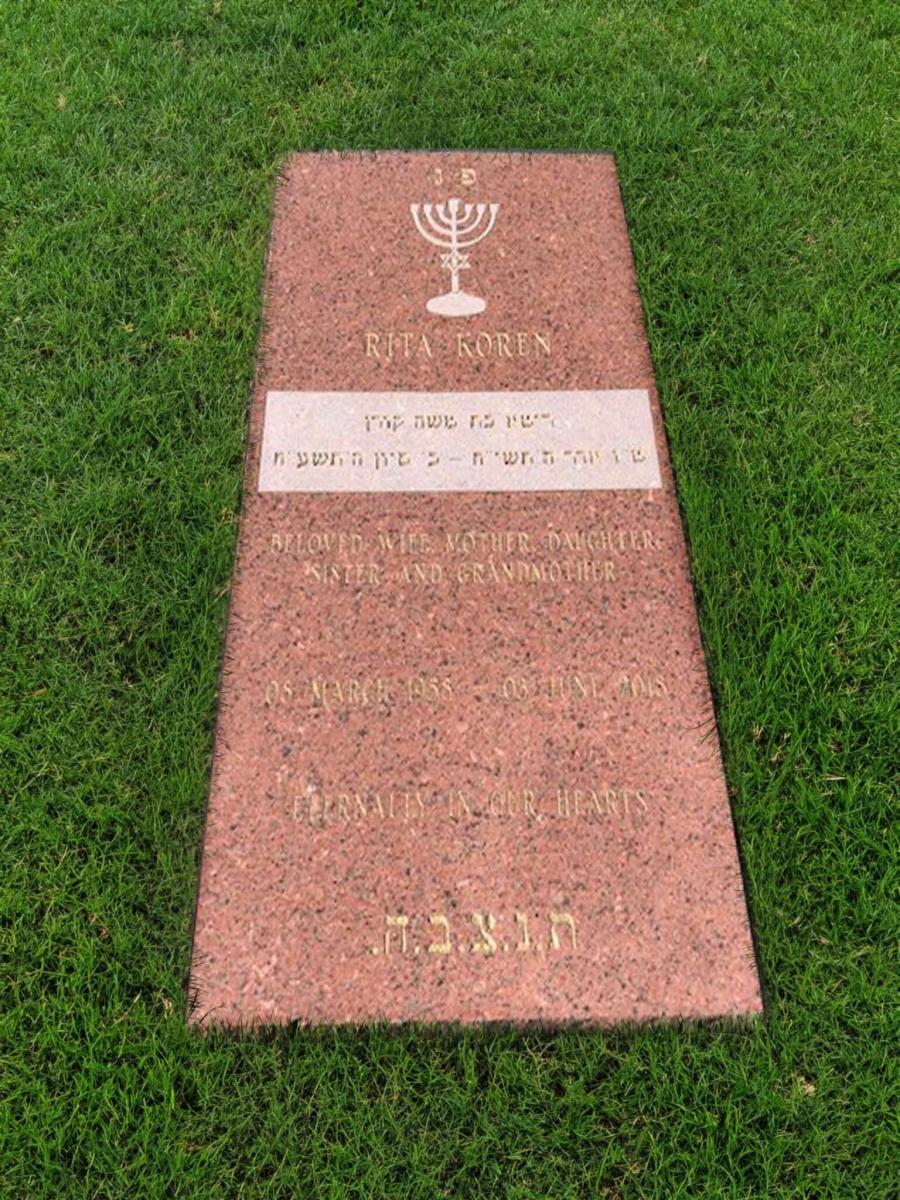 Rose granite grave ledger with gold lettering - City Monument Company